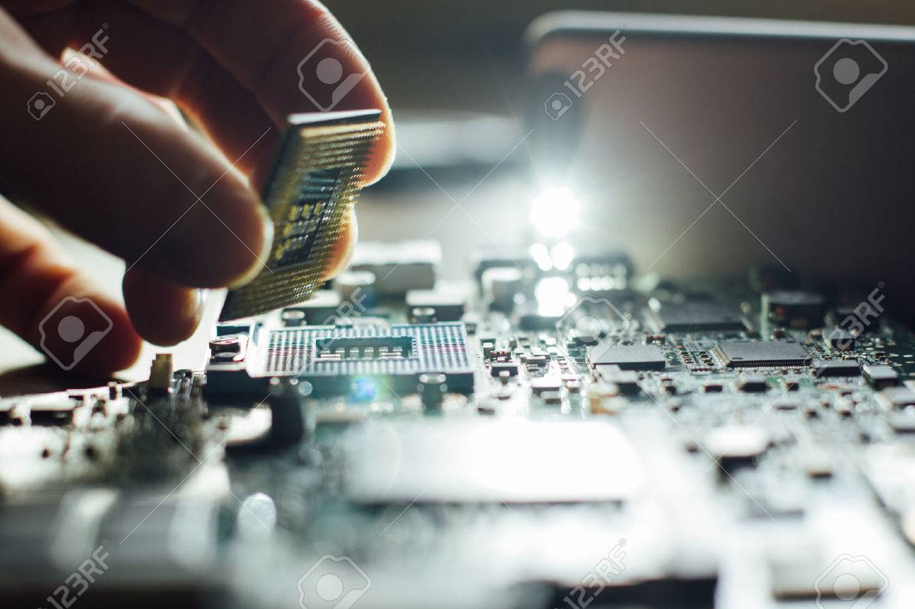 54302124-technician-plug-in-cpu-microprocessor-to-motherboard-socket ...